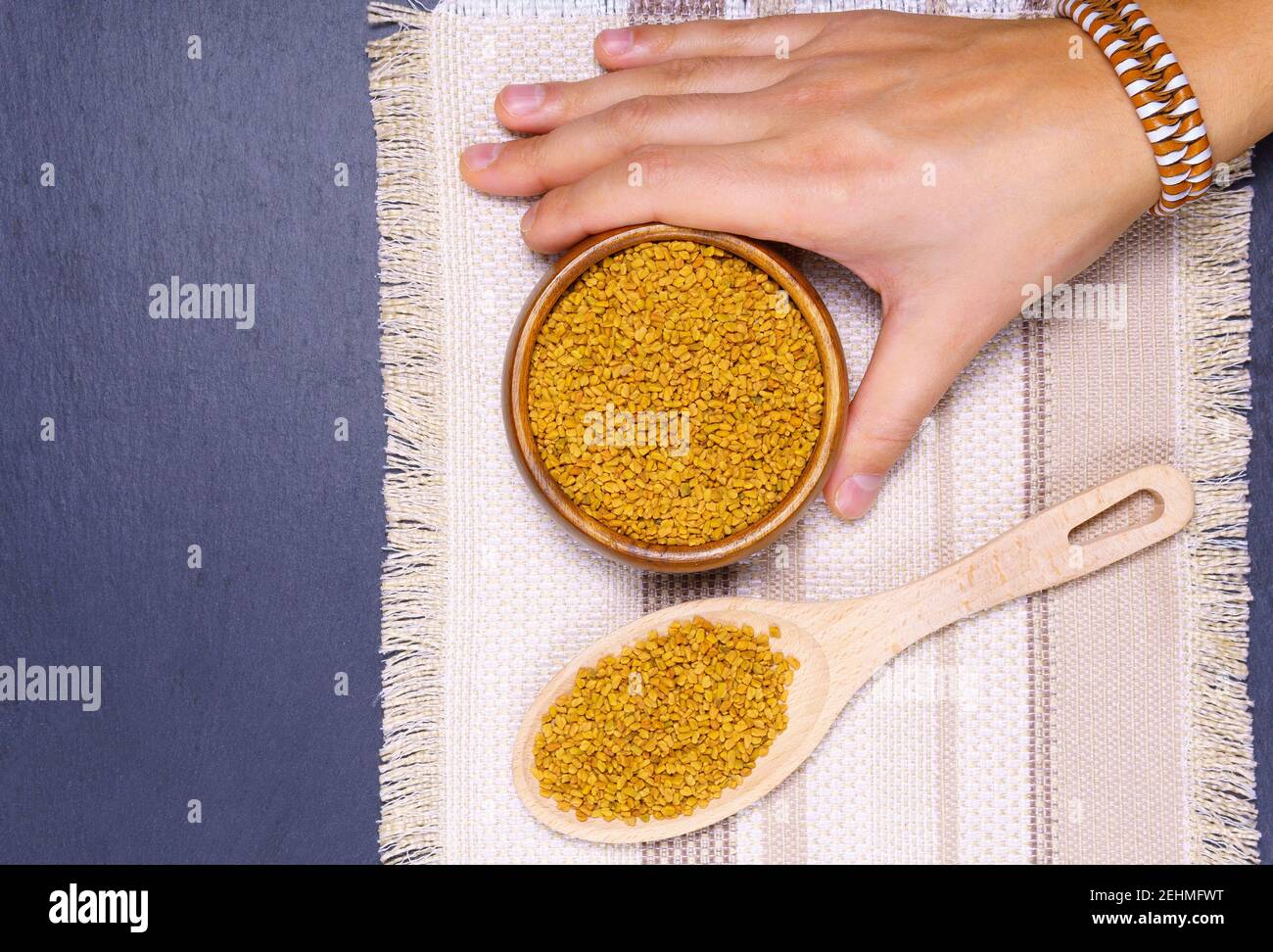 Fenugreek seeds in wooden bowl, spice, culinary ingredient, shamballa ...