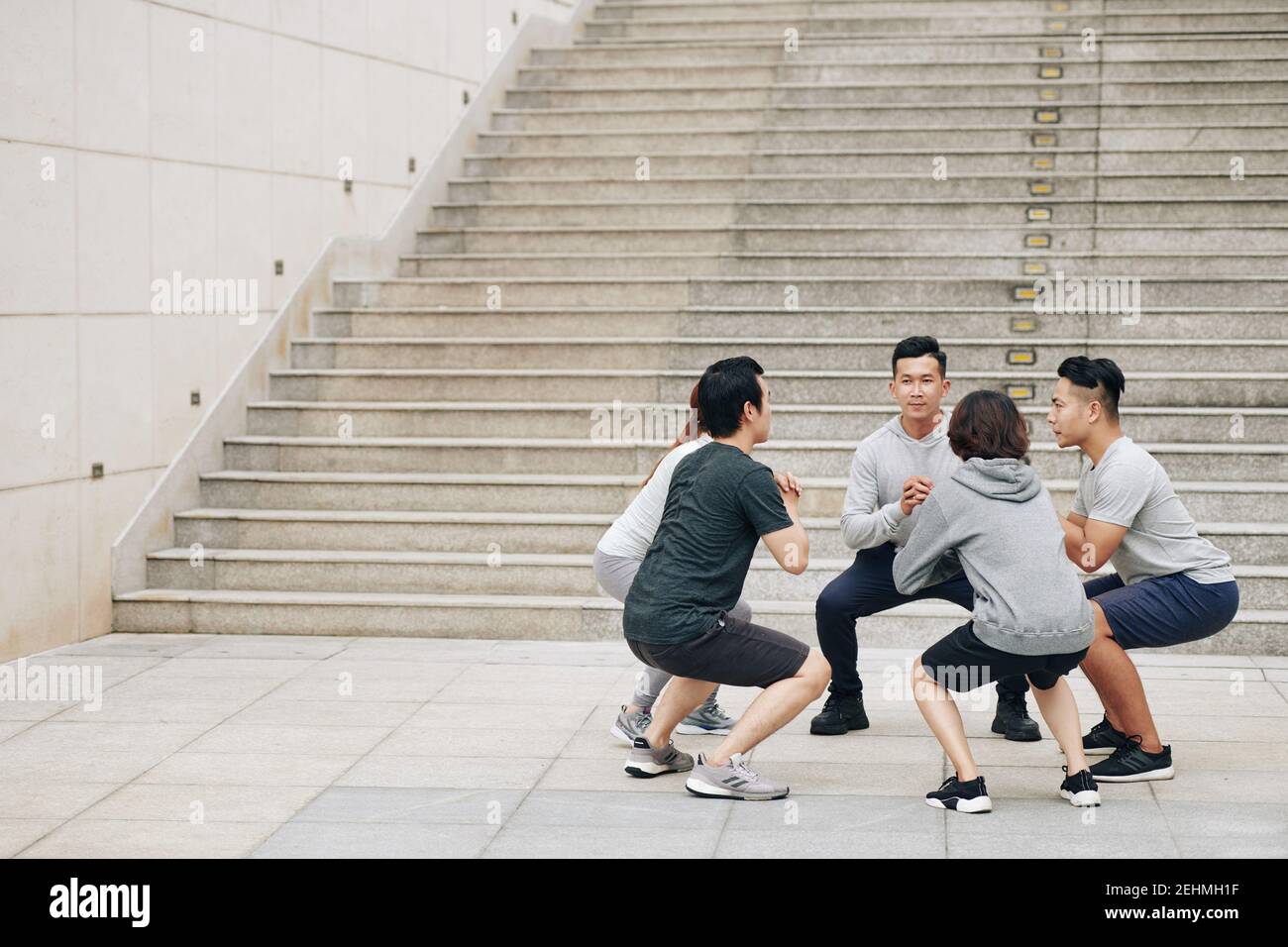 Team squats hi-res stock photography and images - Alamy