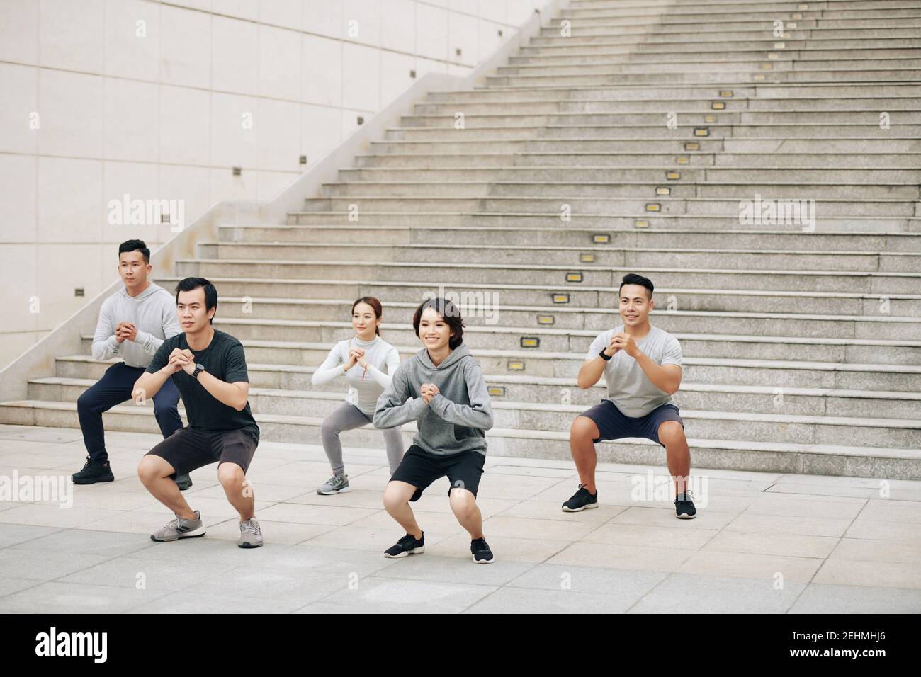 People training together outdoors Stock Photo - Alamy