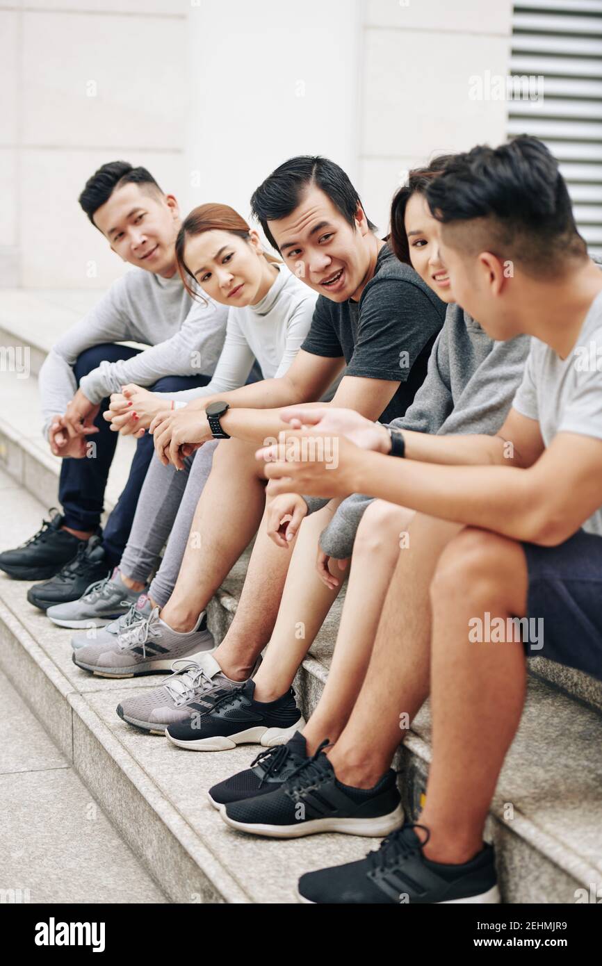 Fir friends talking Stock Photo - Alamy