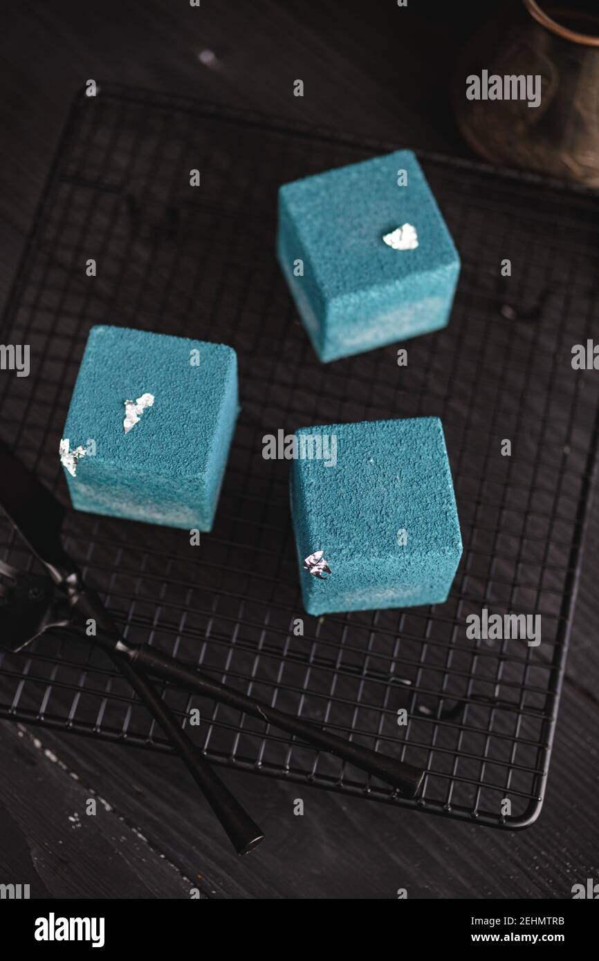 Blue cake filled with orange and tangerine in the shape of a cube ...