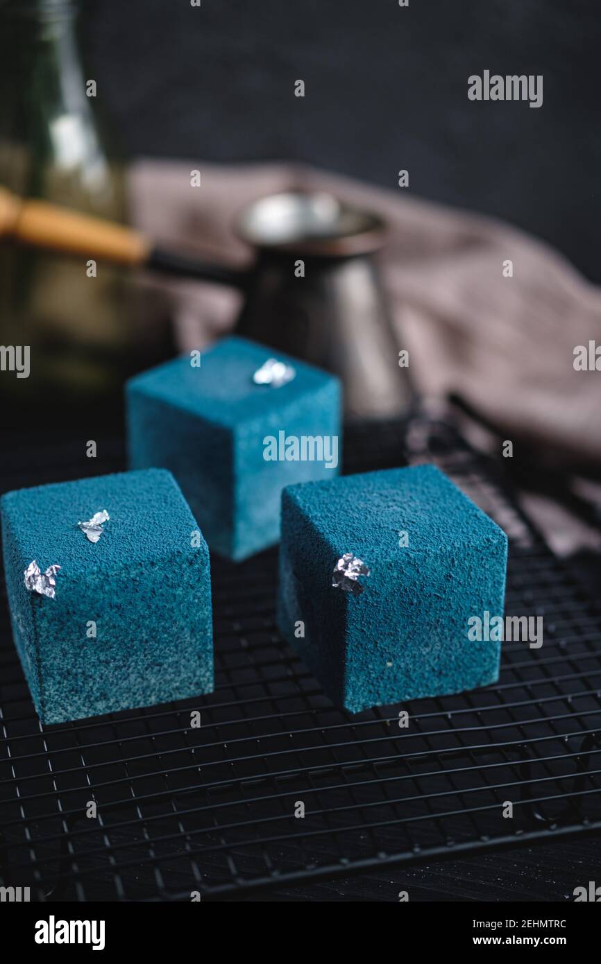 Blue cake filled with orange and tangerine in the shape of a cube ...