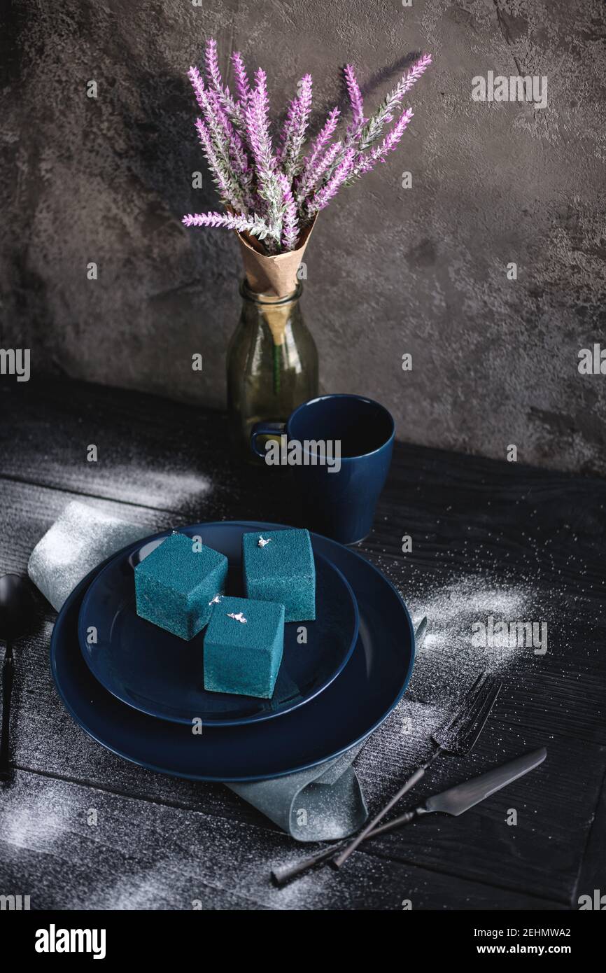 Blue cake filled with orange and tangerine in the shape of a cube ...