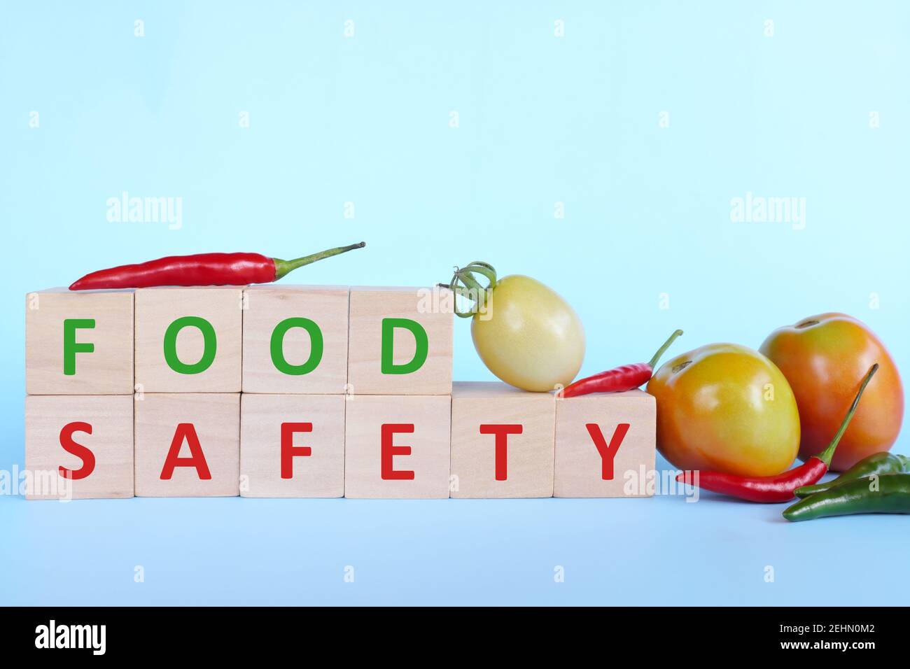 Food safety concept. Tomato and wooden blocks with word safe food on ...