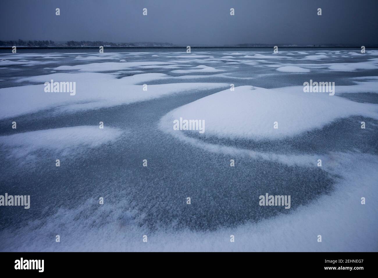 Ice and snow formations form a beautiful coastal winter landscape at ...