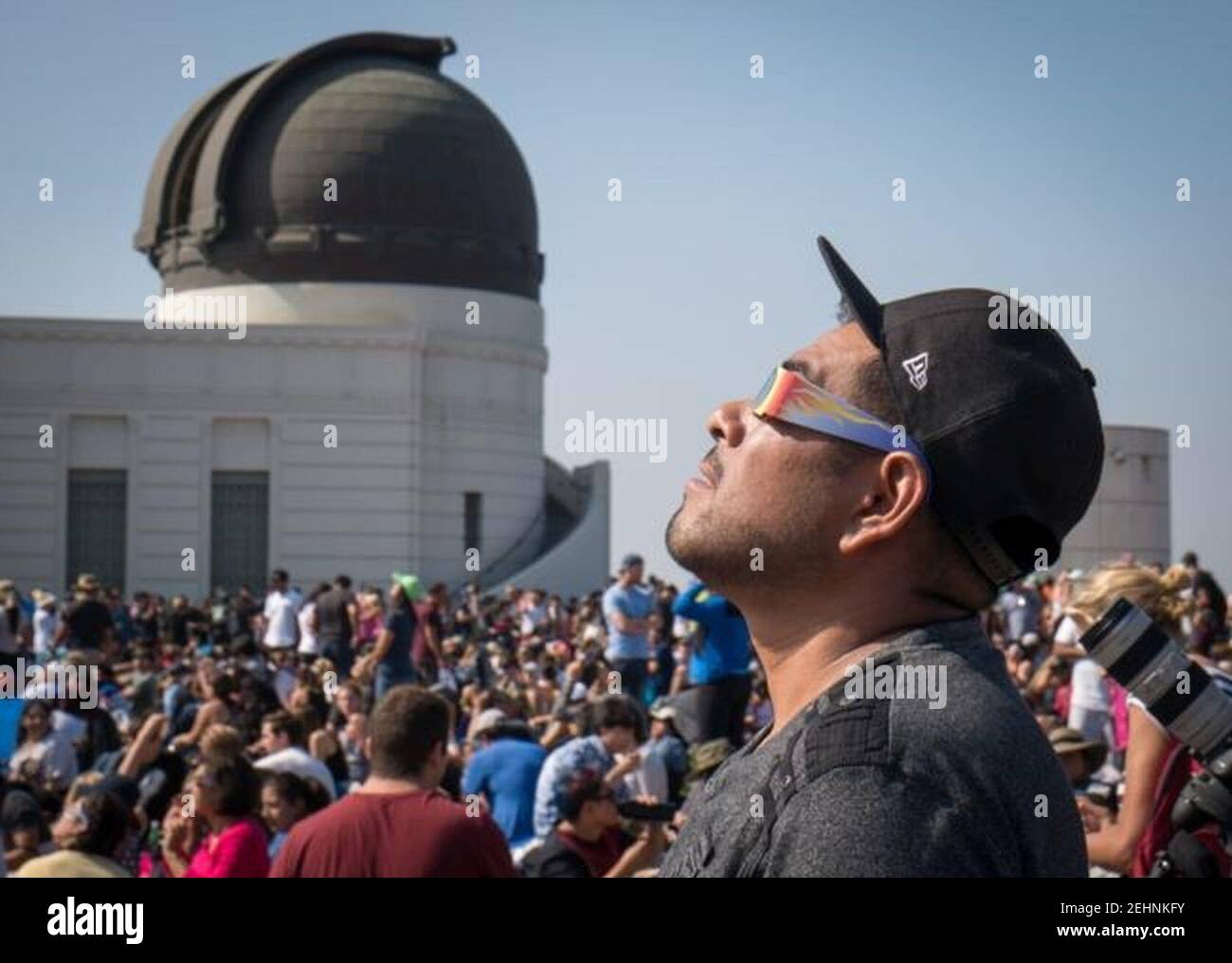 Partial solar eclipse outside Griffith Observatory in Los Angeles Stock ...