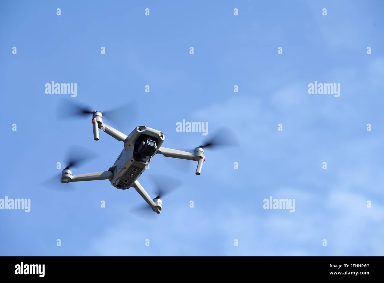 drone flying in air, blue sky with white clouds Stock Photo - Alamy
