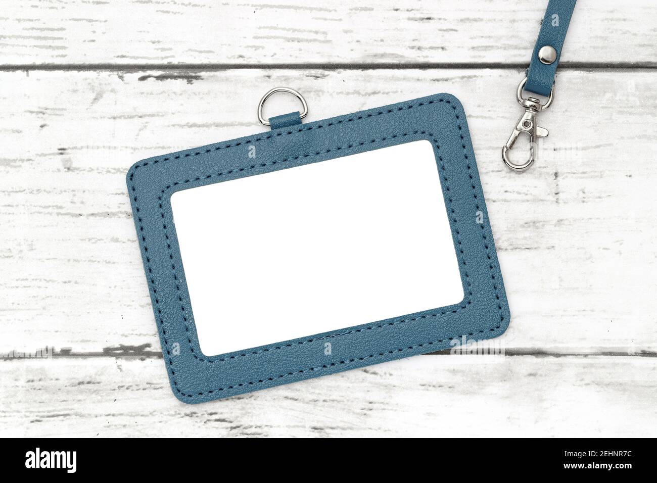 Blank ID, Blank security badge on wooden table Stock Photo - Alamy