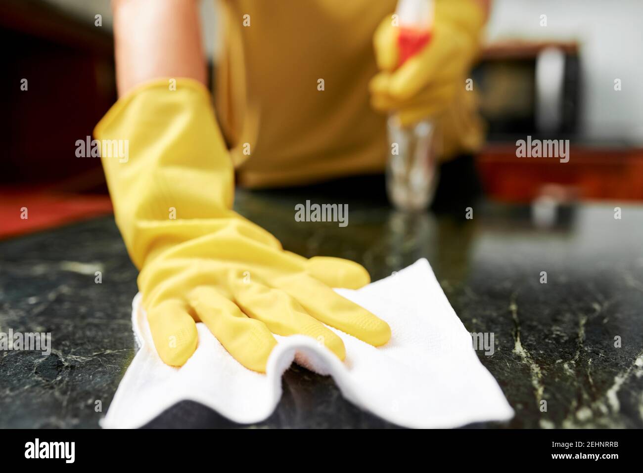 Housewife cleaning kitchen counter Stock Photo - Alamy