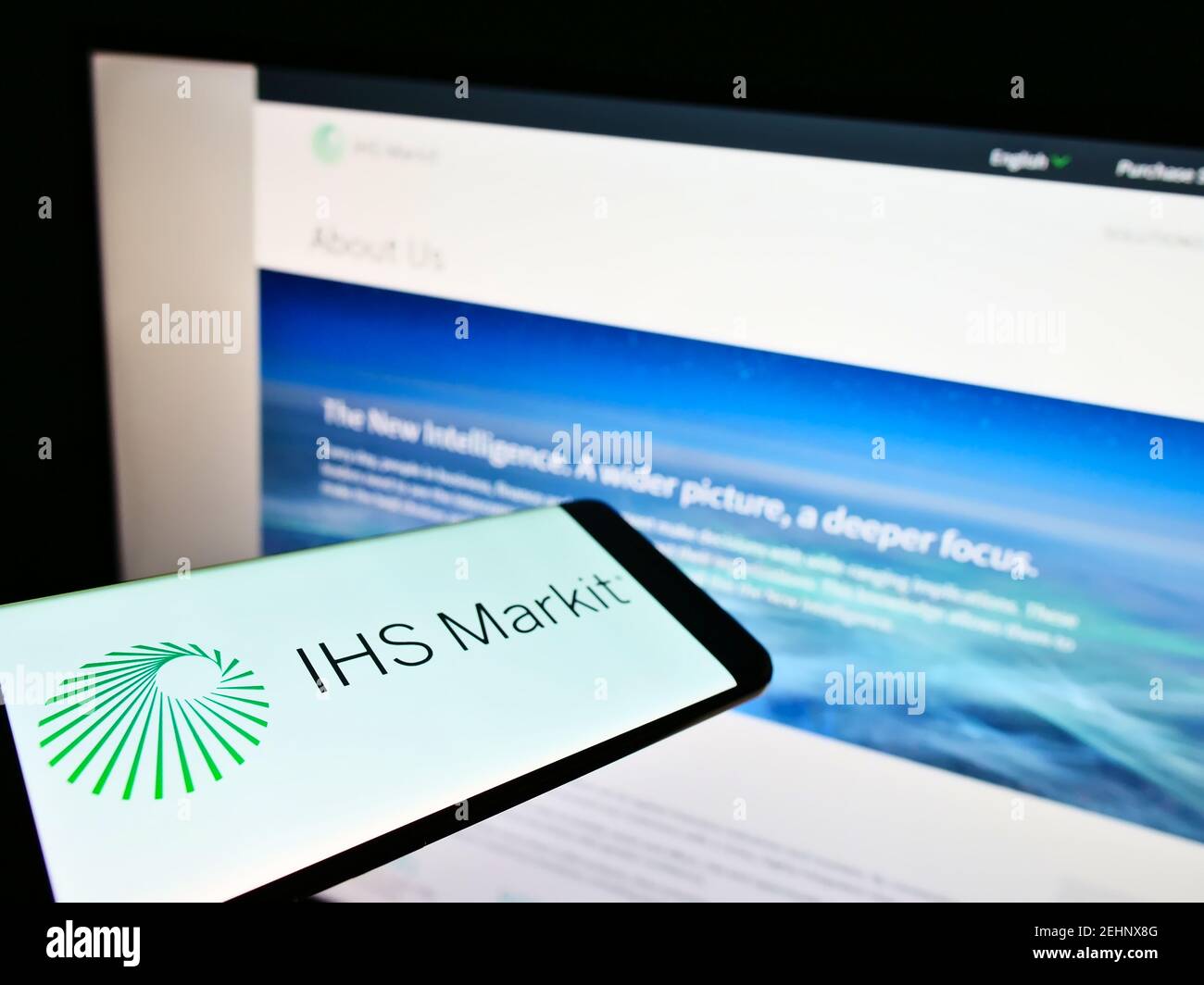 Cellphone with business logo of British information provider IHS Markit ...