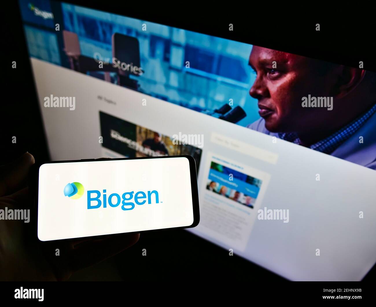 Person holding smartphone with logo of American biotechnology company ...