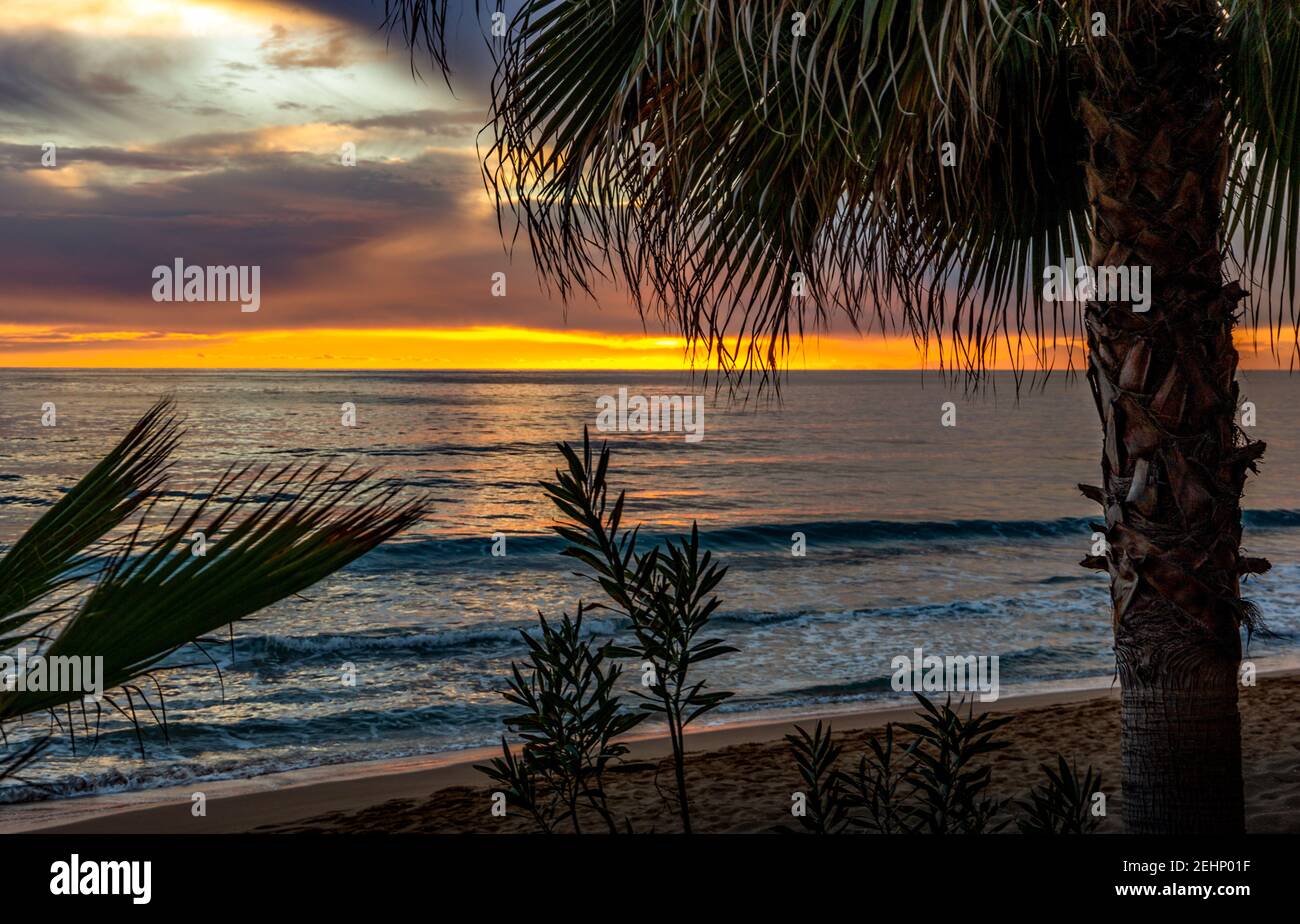 View of a sunset over a sea Stock Photo - Alamy