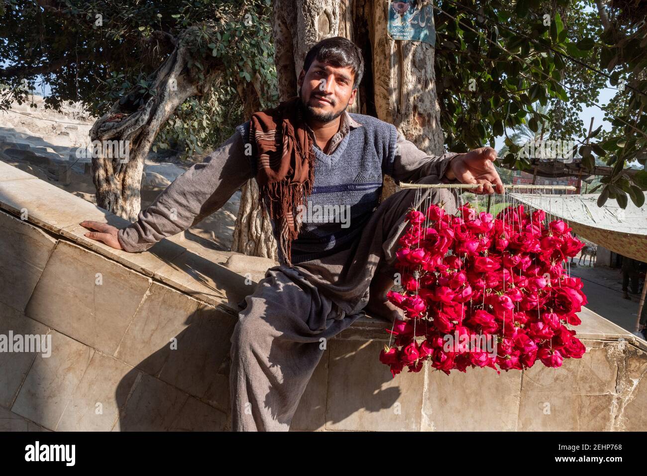 Man Selling Flowers To Pilgrims, Uch Sharif, Punjab, Pakistan Stock ...