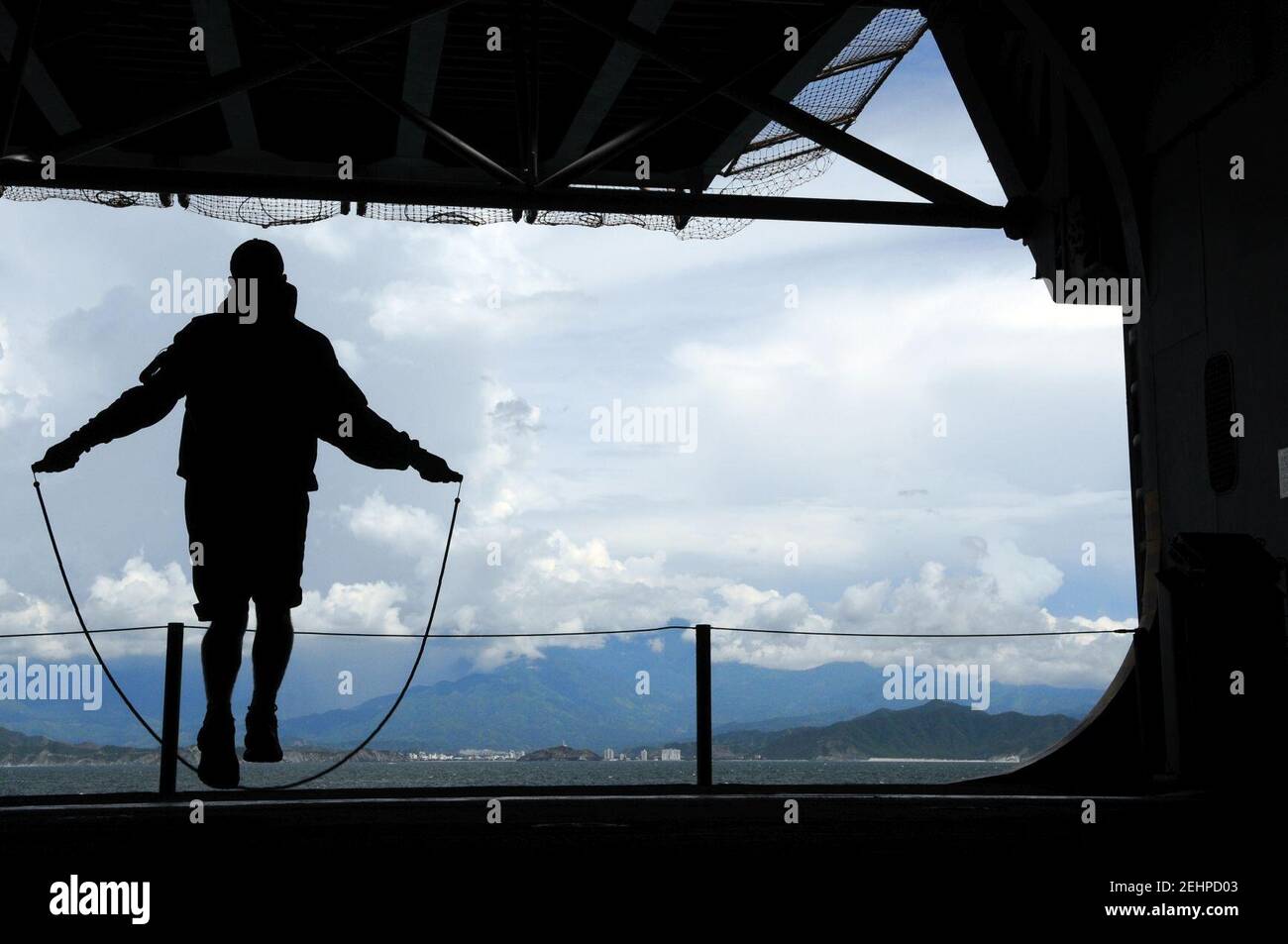 Passing time with a jump rope Stock Photo - Alamy