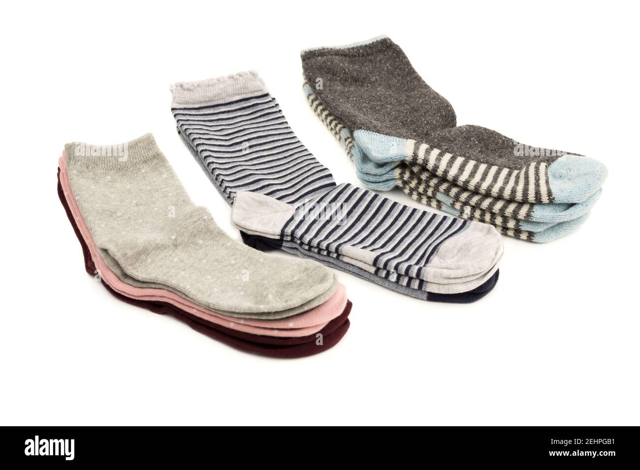 Three stacks of socks isolated on white background Stock Photo - Alamy