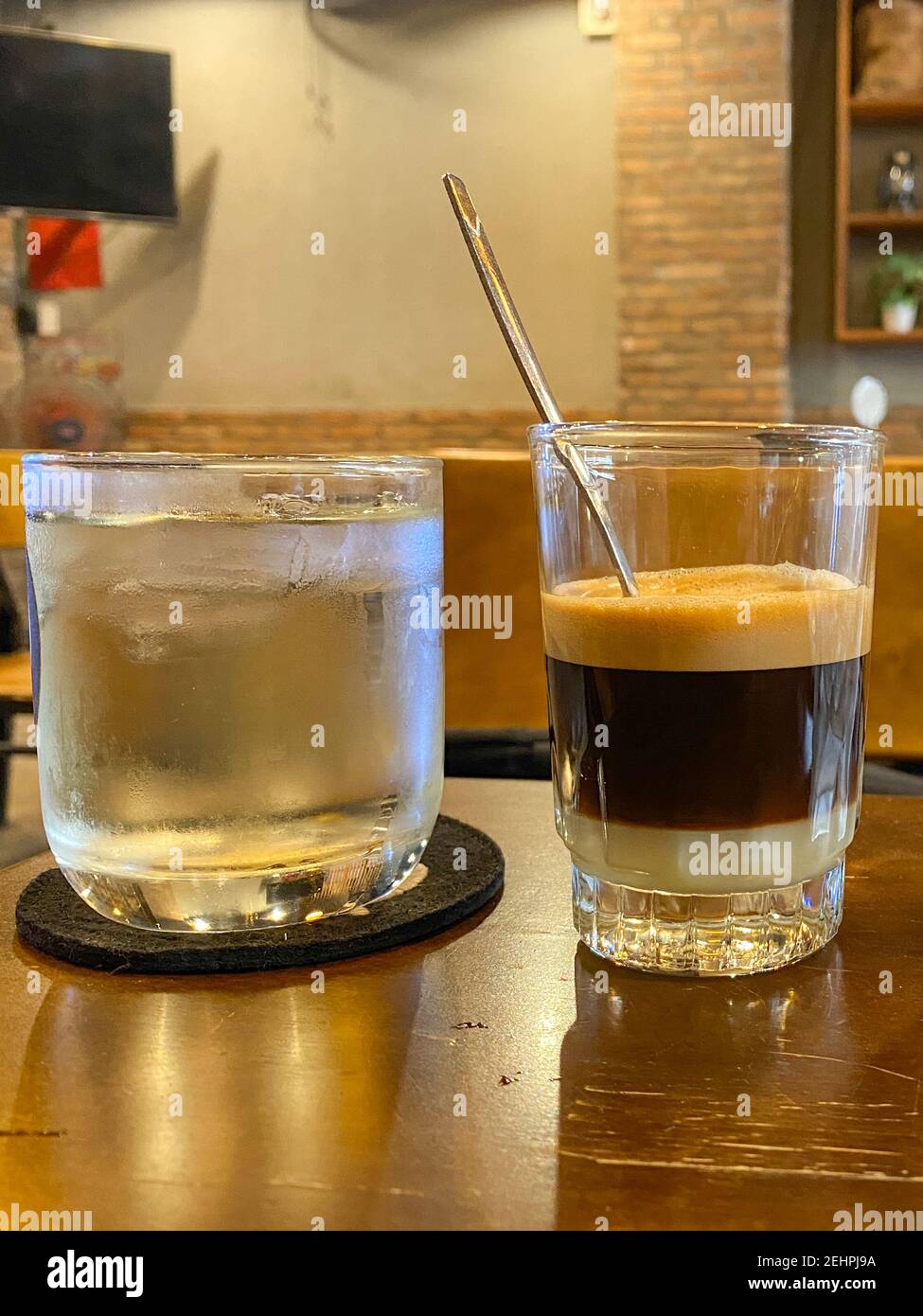 Vertical photo of traditional Vietnamese fin coffee with condensed milk ...