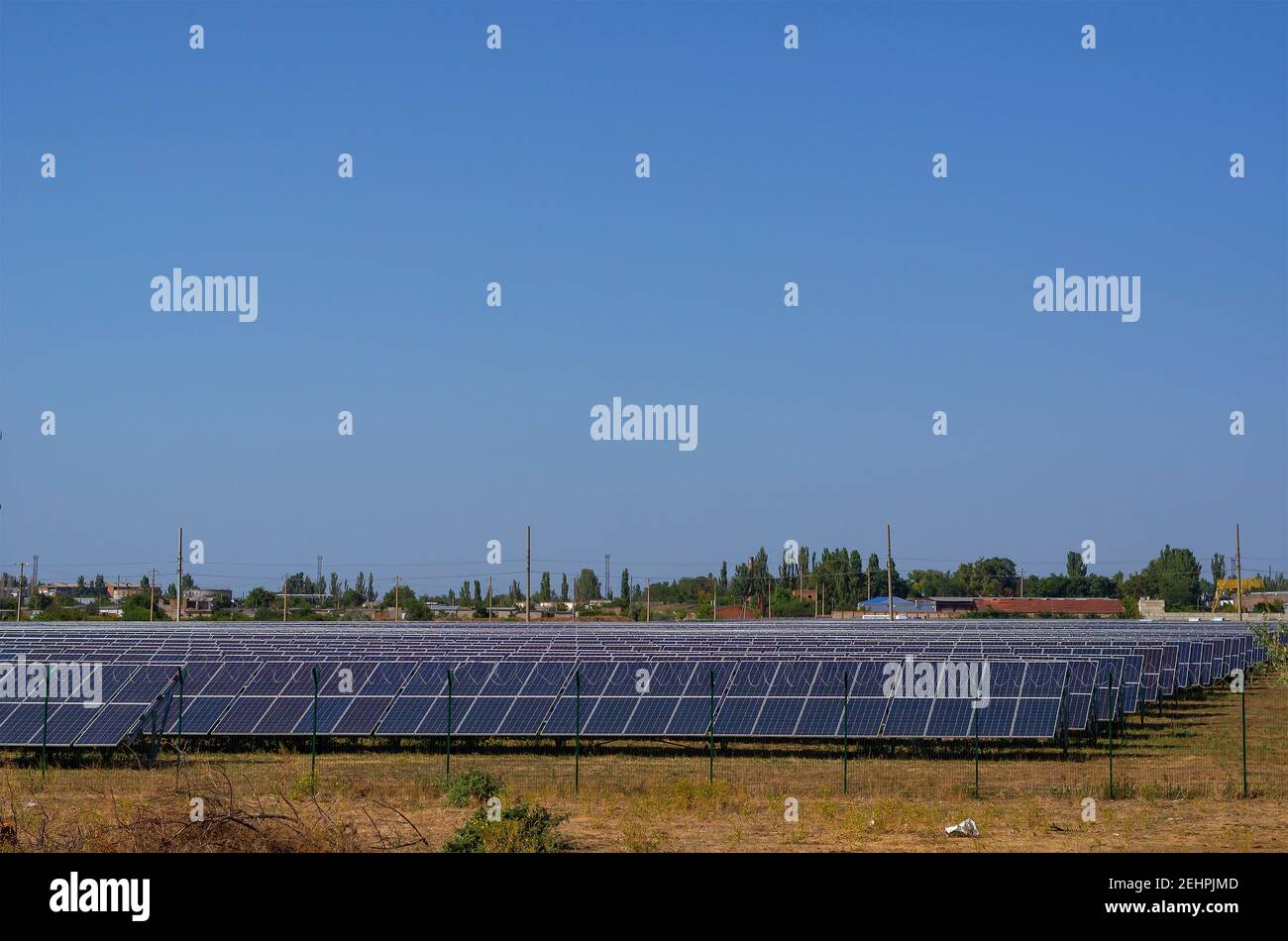 Solar panels in field against sun hi-res stock photography and images ...