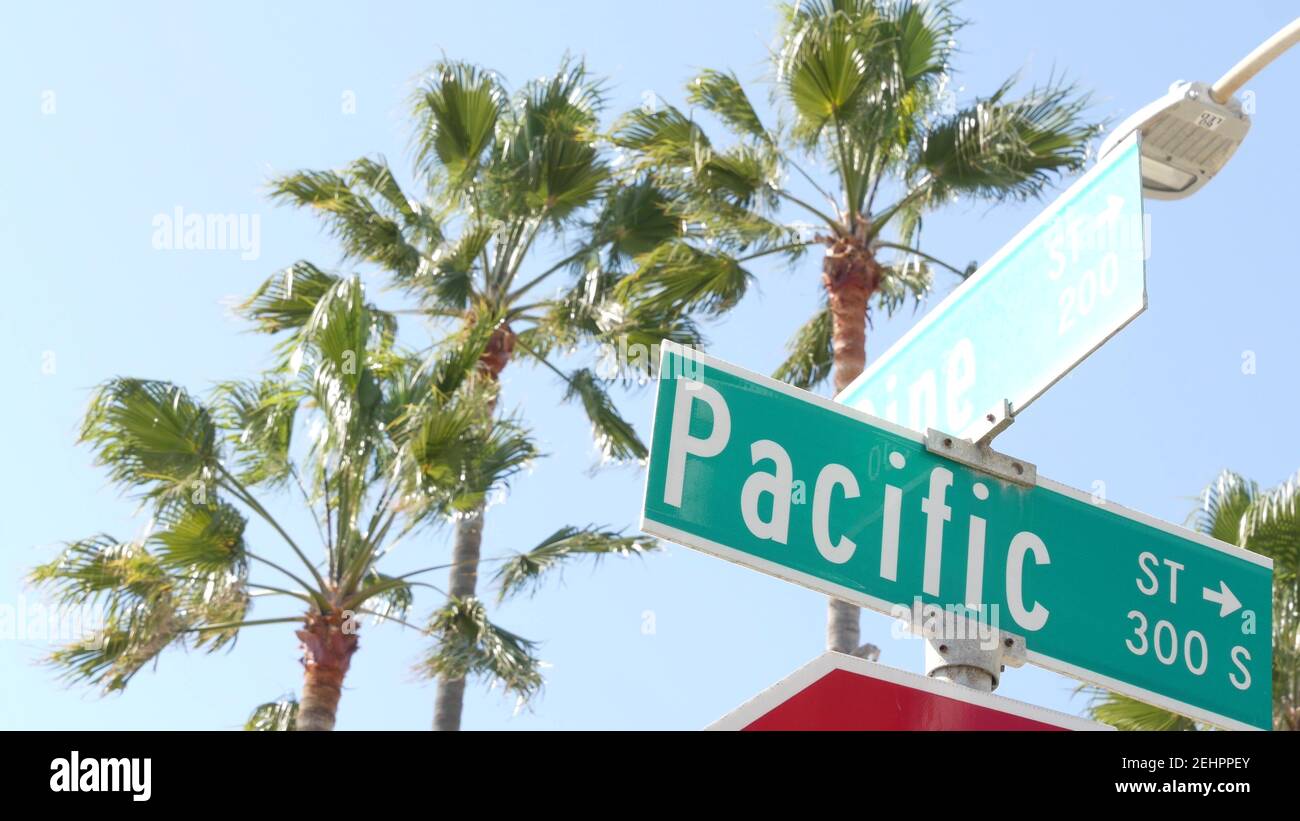Pacific street road sign on crossroad, route 101 tourist destination ...