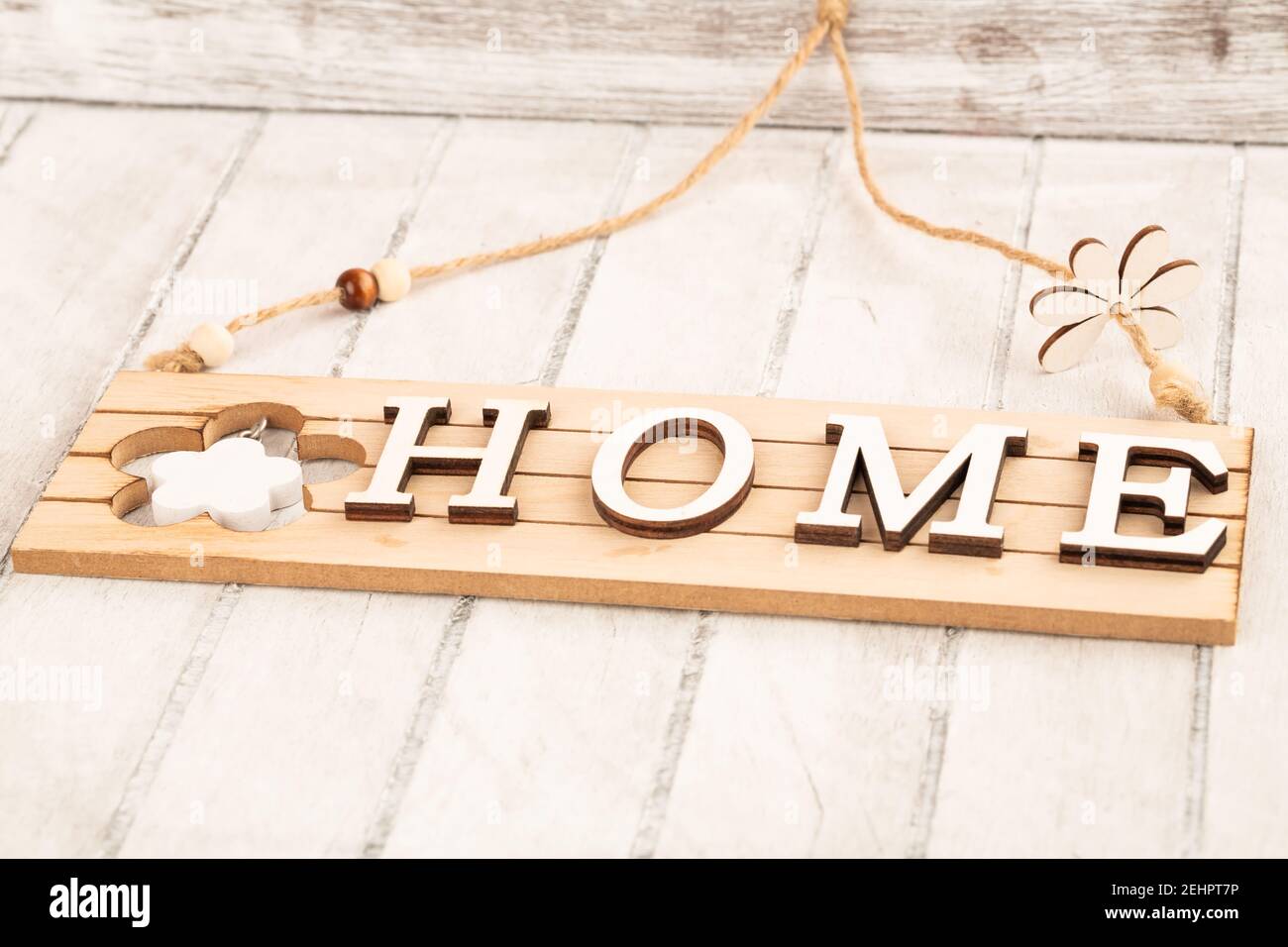 Wooden sign with word Home on gray board background Stock Photo - Alamy