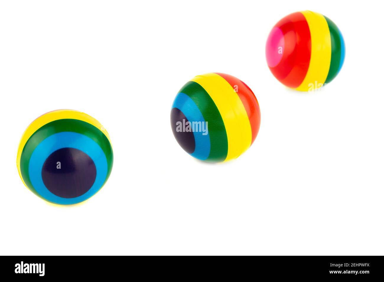 Three colorful balls isolated on white background Stock Photo - Alamy