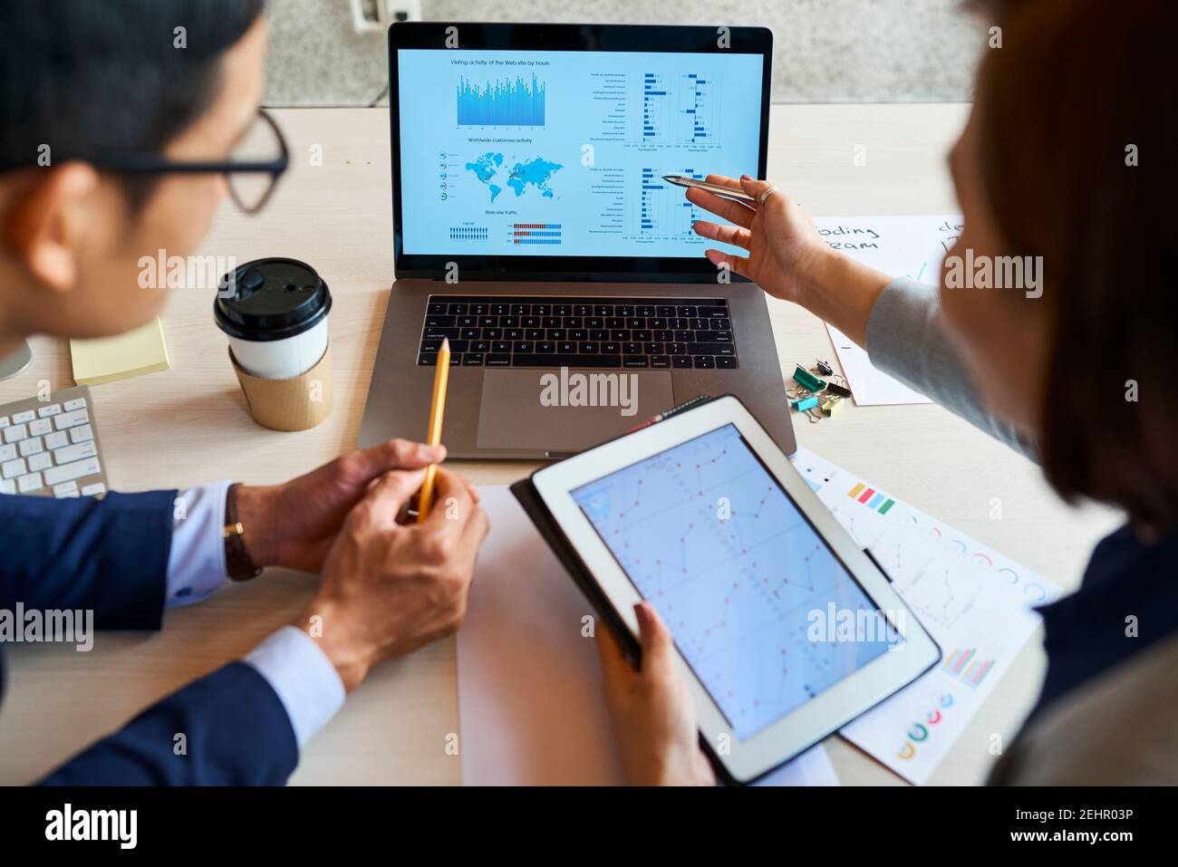 Business colleagues discussing statistics Stock Photo - Alamy
