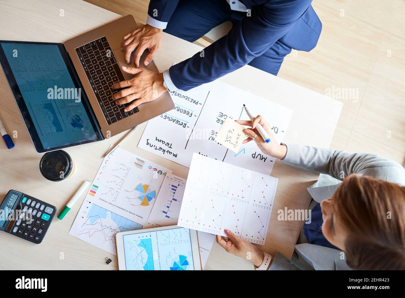 Managers controlling project completion Stock Photo - Alamy