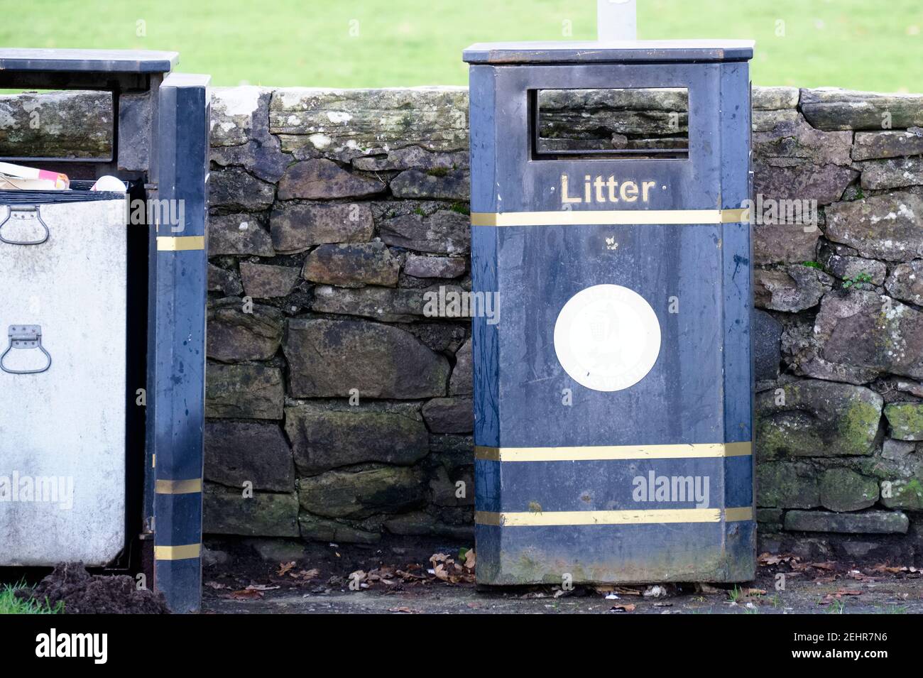 Black litter bin for rubbish in public area Stock Photo - Alamy