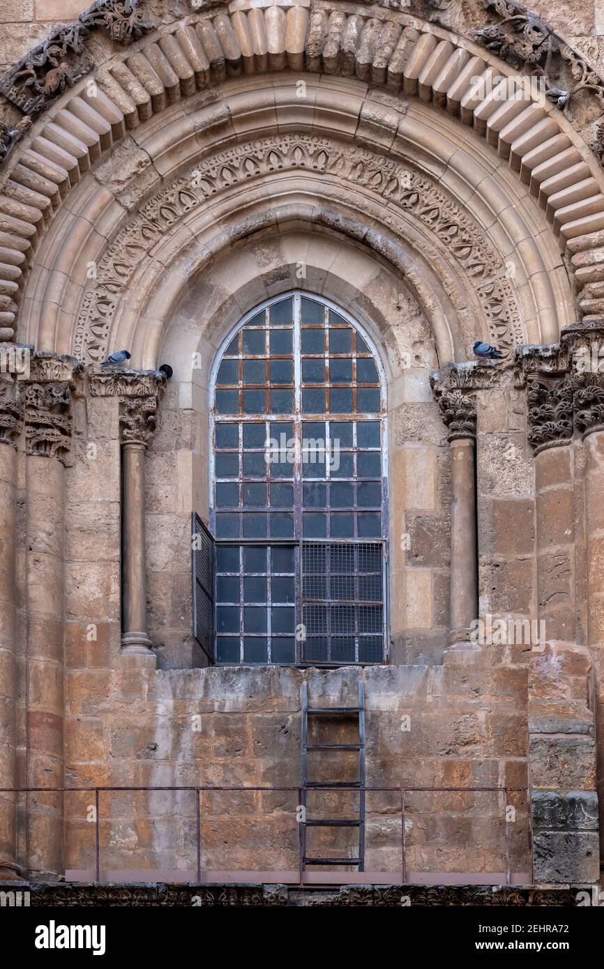 The immovable ladder which leans against a window ledge in the upper ...