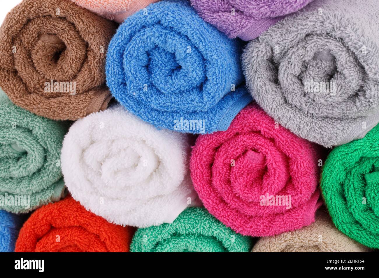 Colorful rolled towels stack closeup picture Stock Photo - Alamy