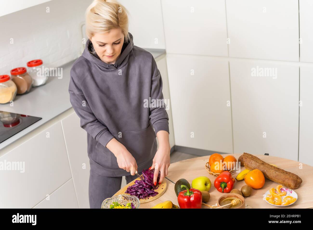 Healthy food. Woman preparing fruits and vegetables Stock Photo - Alamy