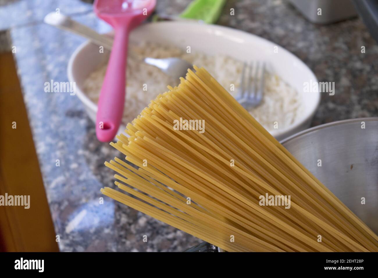 cooking for brunch preparing spaghetti pasta and rice Stock Photo - Alamy