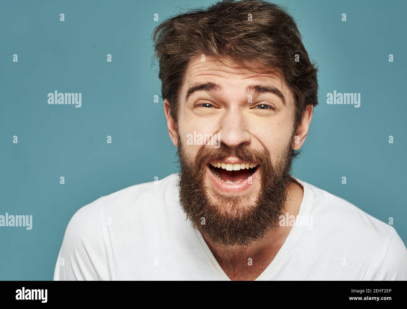 Happy man joy delight emotions blue background thick beard Stock Photo ...