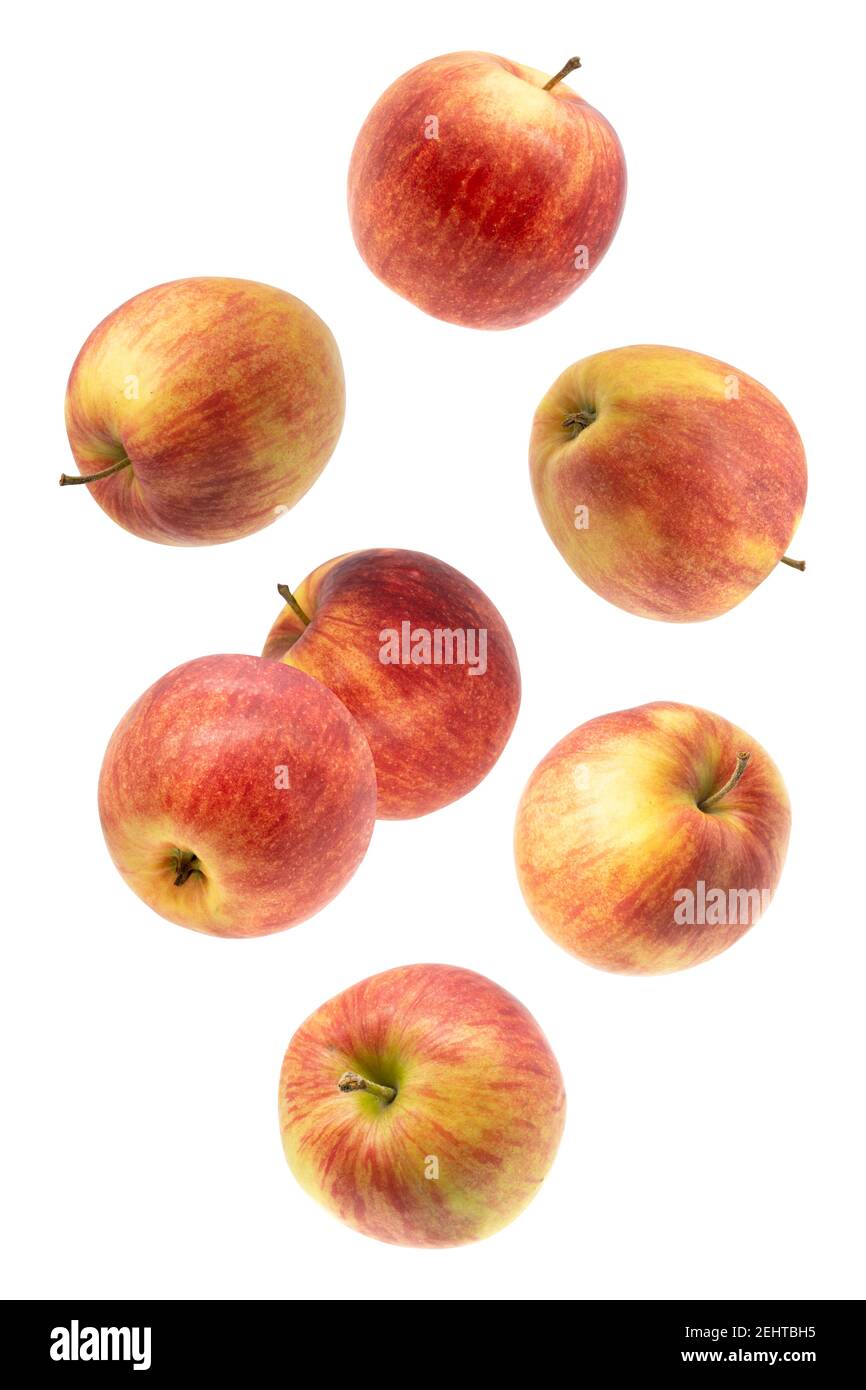 Falling red juicy apple isolated on white background Stock Photo - Alamy