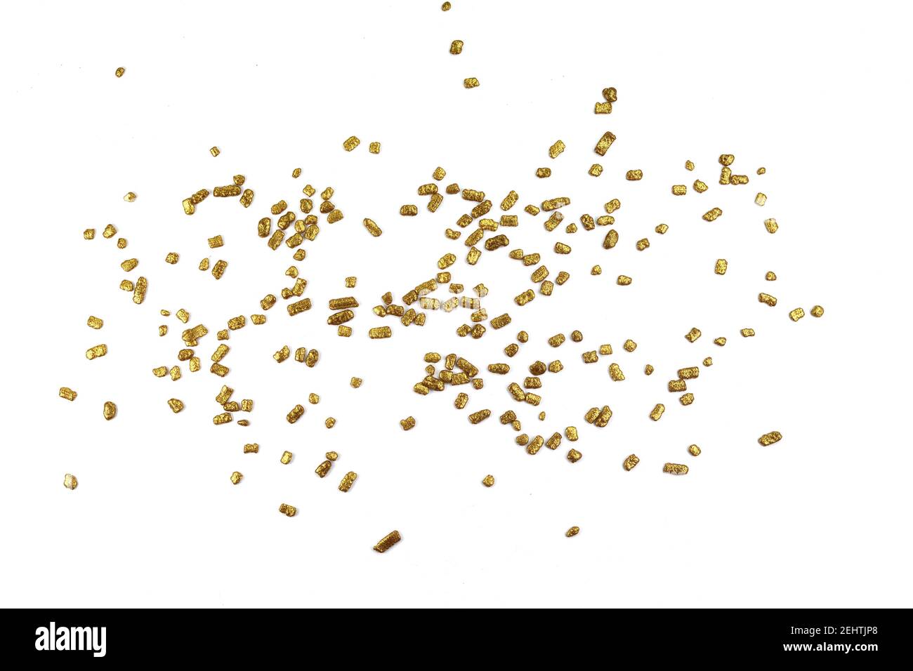 Golden sprinkles isolated on white background top view. Sweet golden ...