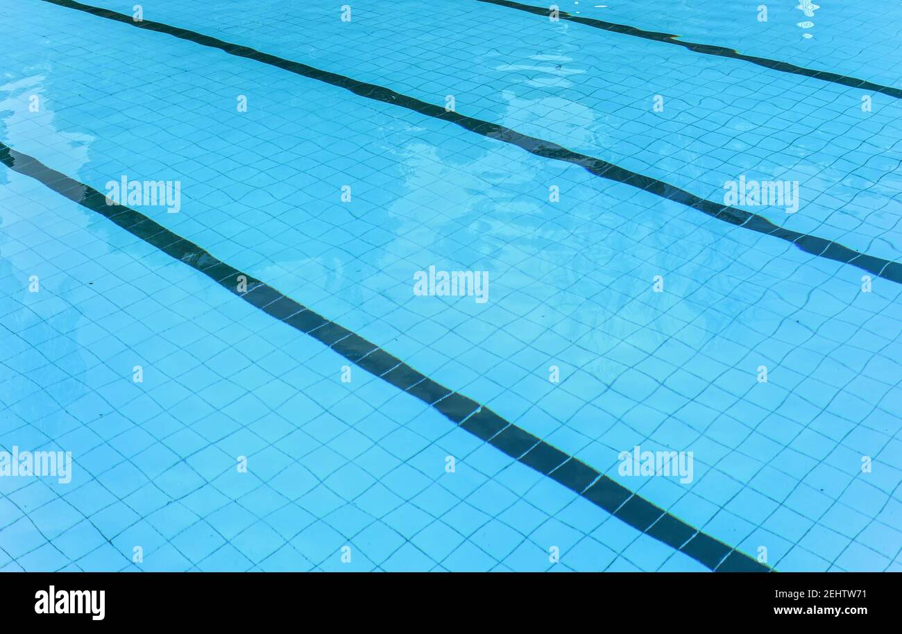 Calm water on empty swimming pool, dark lanes marks visible floor Stock ...