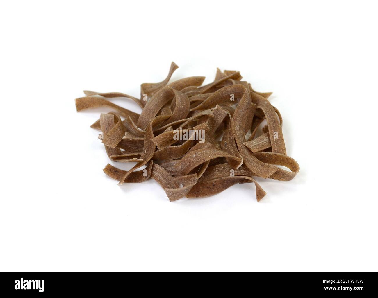 Dry ancooked buckwheat pasta on white background. Tagliatella pasta ...
