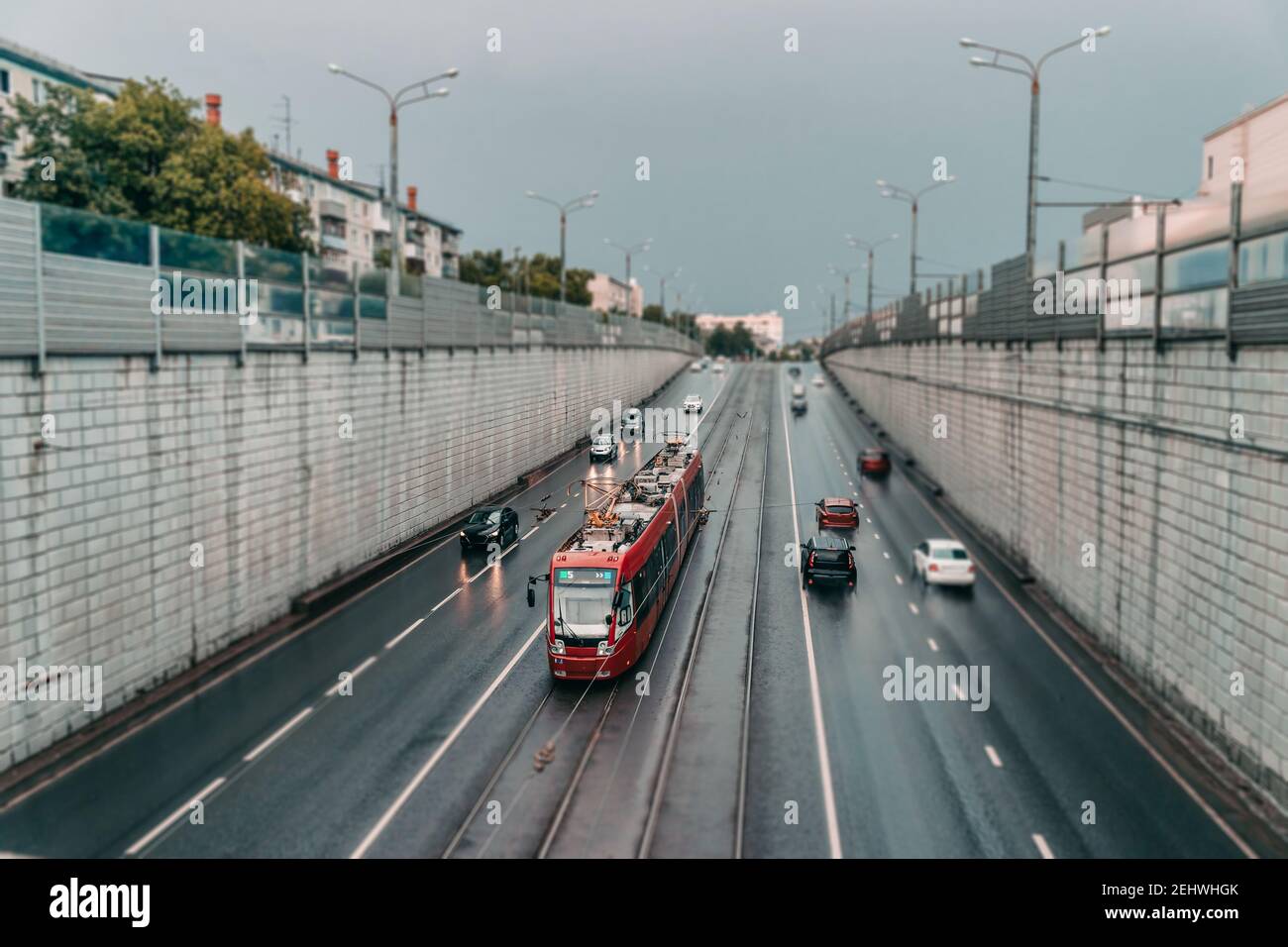 Red modern tram on the street in Kazan, Russia. Kazan's tram networks ...