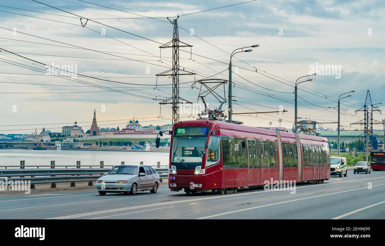 Red modern tram on the street in Kazan, Russia. Tram in front of the ...