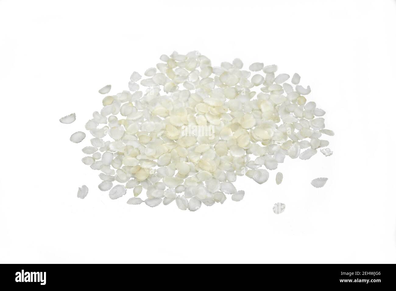 flattened rice flakes isolated on white Stock Photo - Alamy