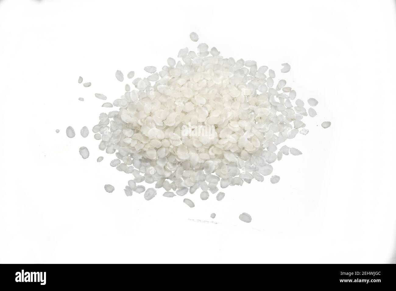 flattened rice flakes isolated on white Stock Photo - Alamy