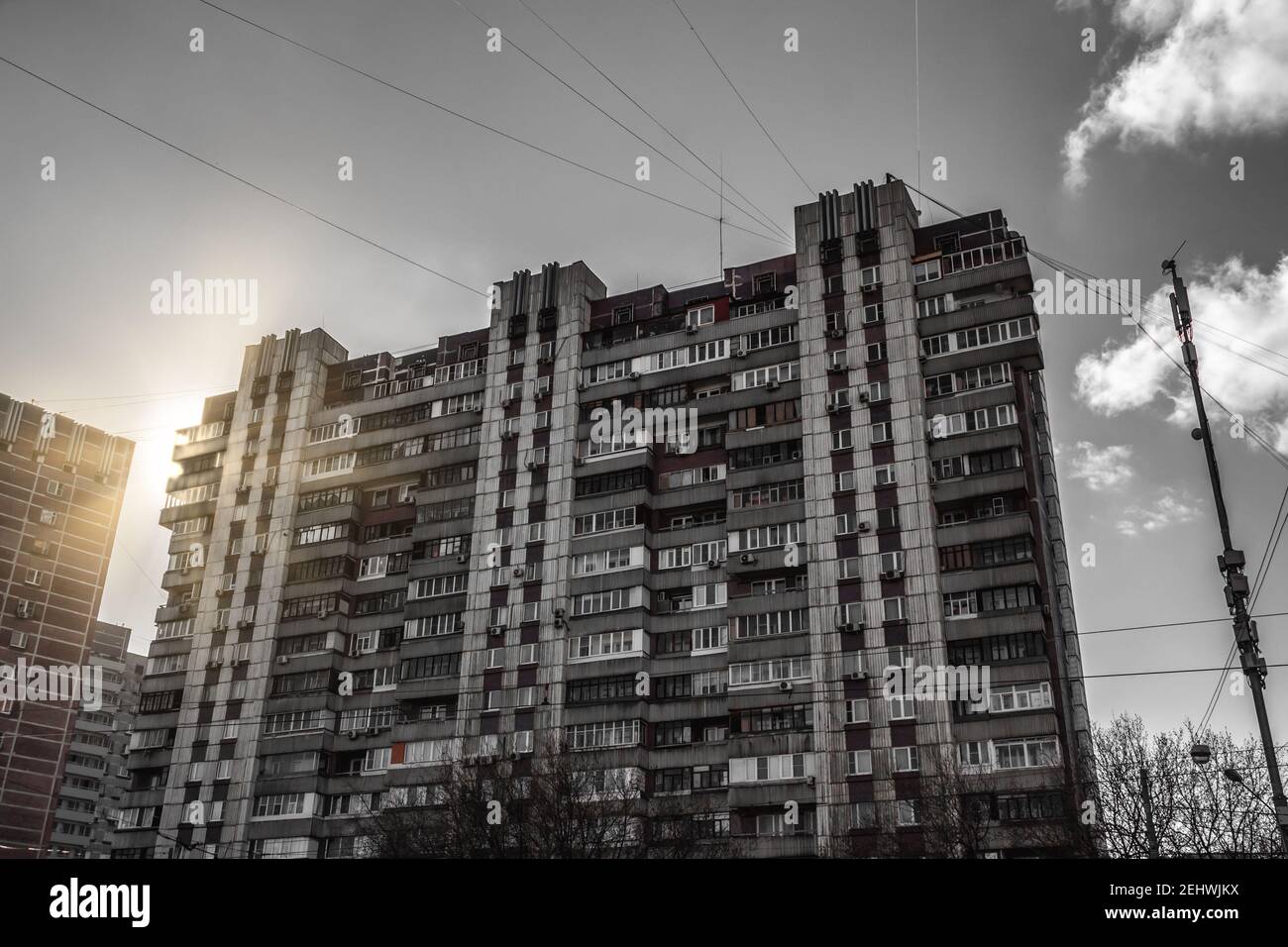 A gloomy Soviet high-rise building. Sunbeam. Old economy class building ...