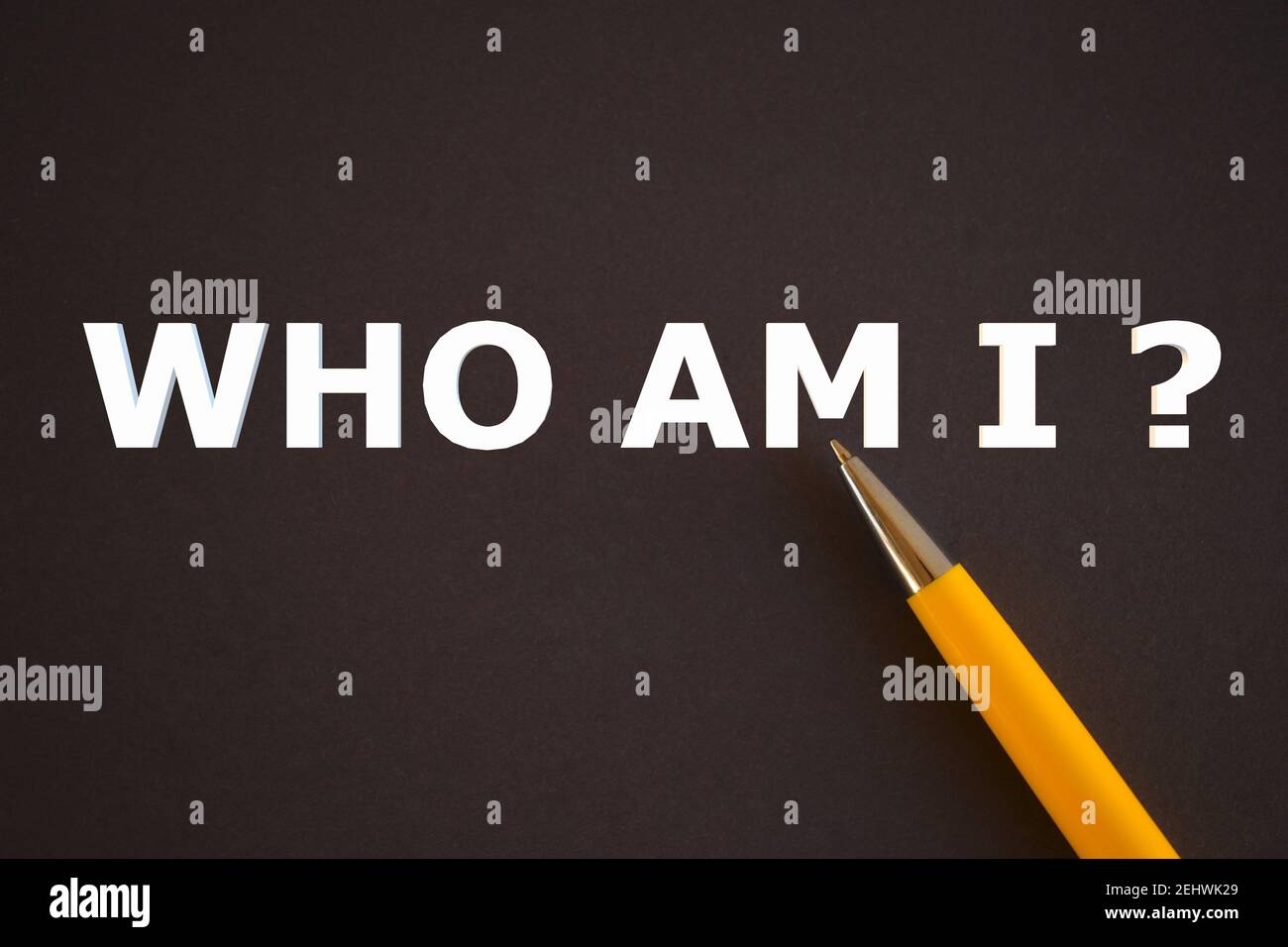 Who am I text written over dark background Stock Photo - Alamy