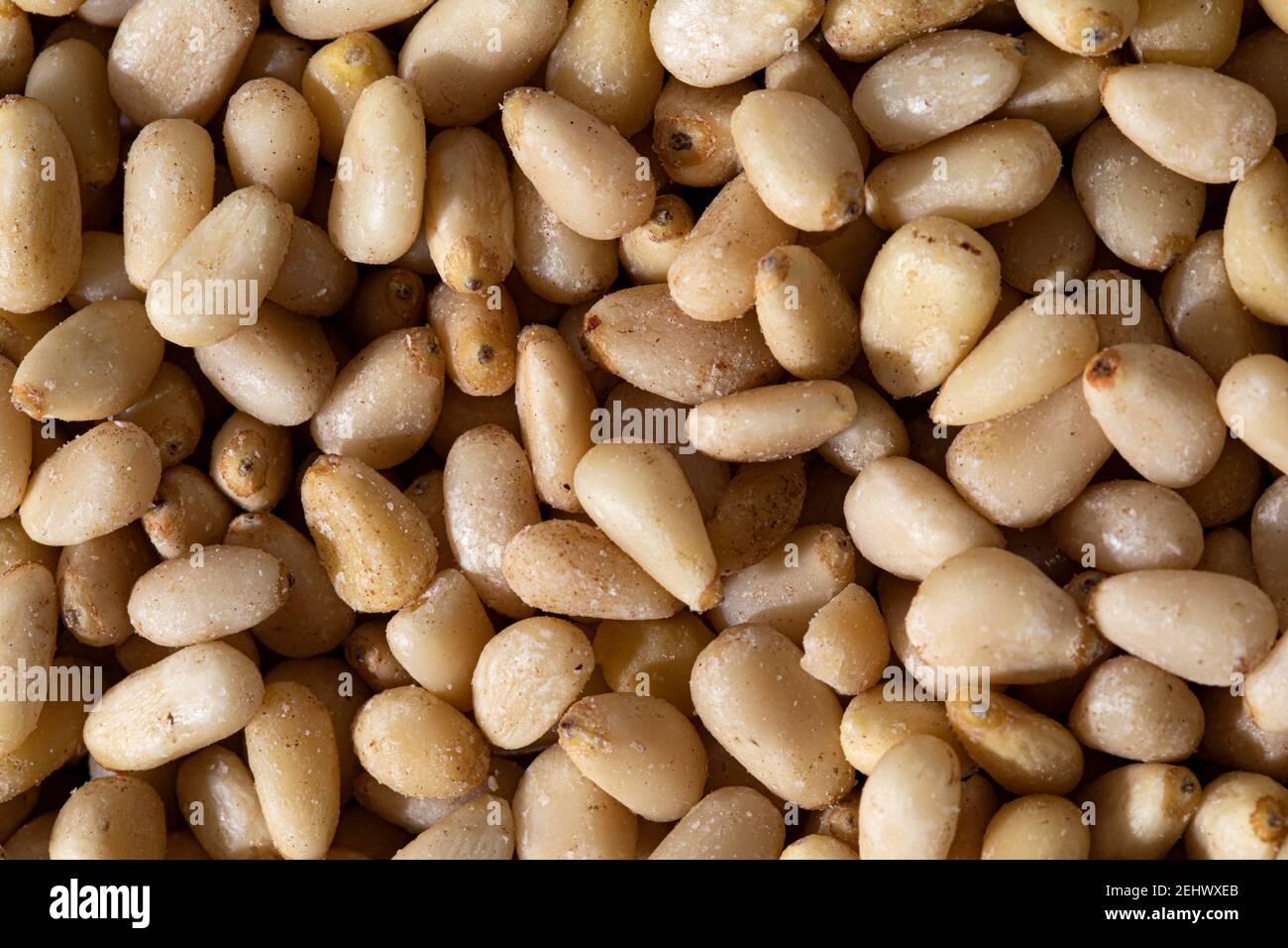 Full frame macro shot of ingredient raw pine nuts Stock Photo - Alamy