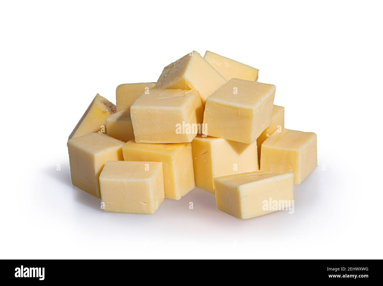 Macro shotfrom heap of yellow dutch cheese, cut in little blocks ...