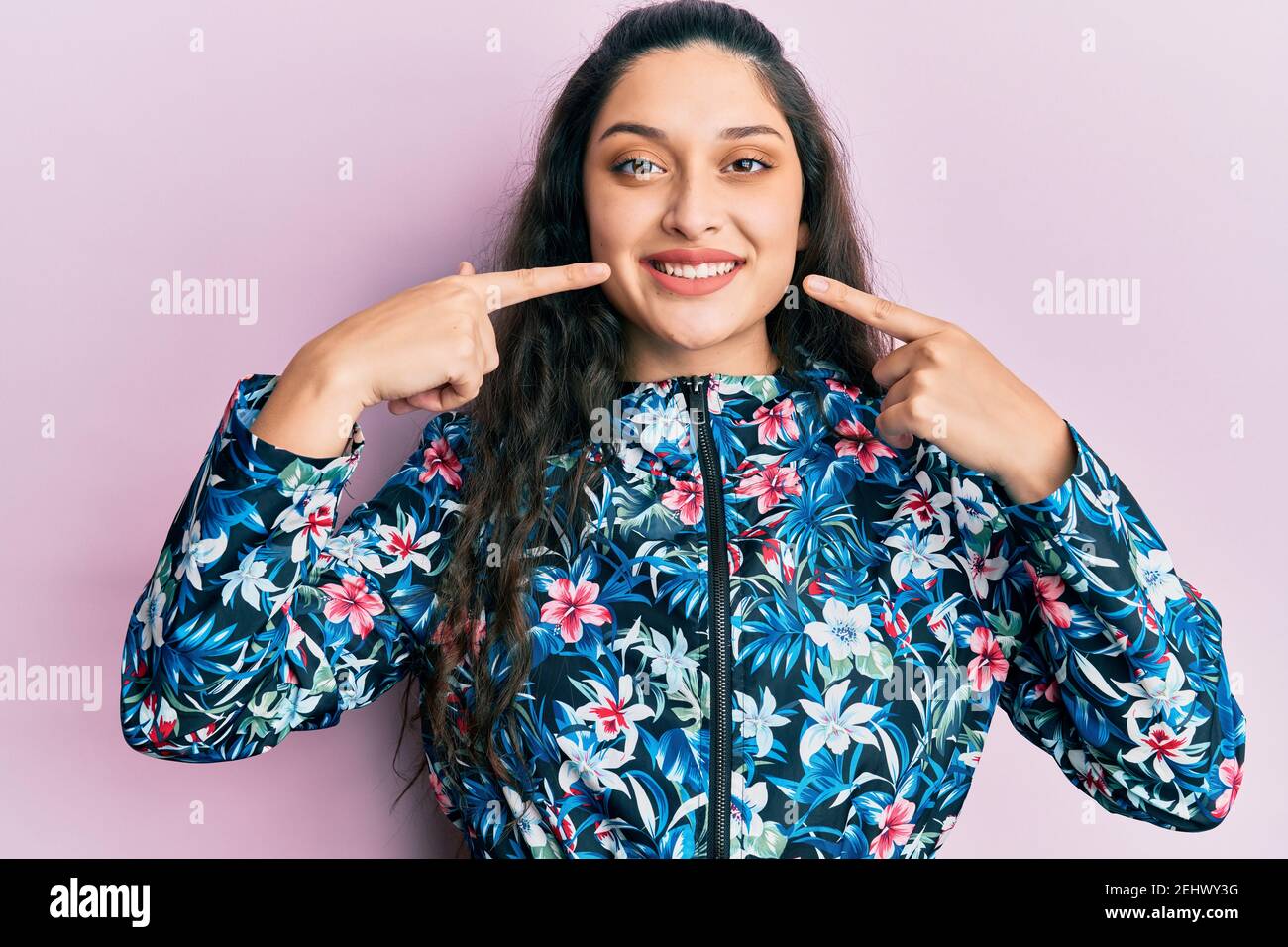 Beautiful middle eastern woman wearing casual floral jacket smiling ...