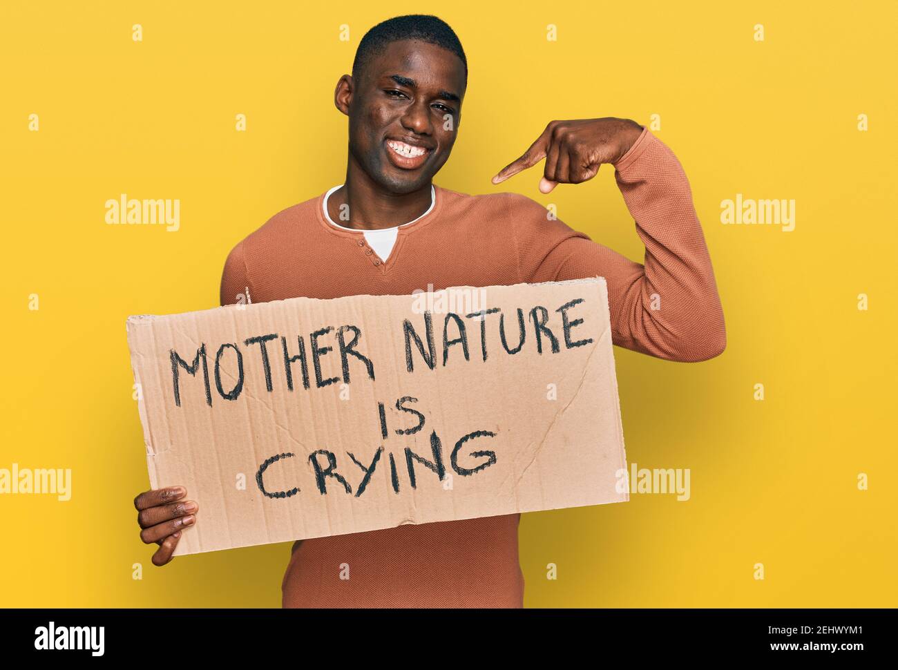 Young african american man holding mother nature is crying protest ...