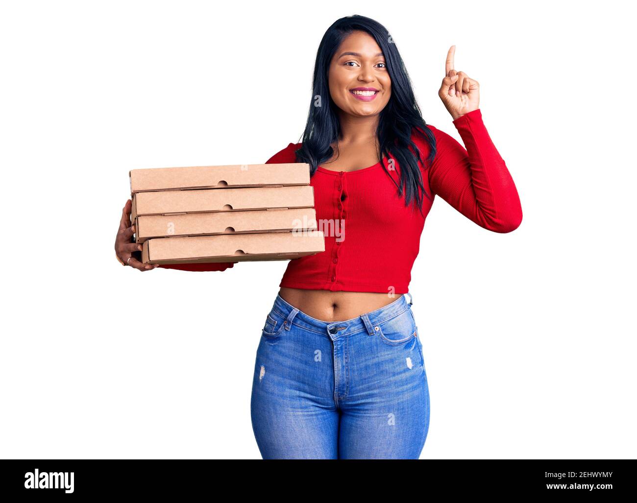 Hispanic woman with long hair holding delivery pizza box surprised with ...