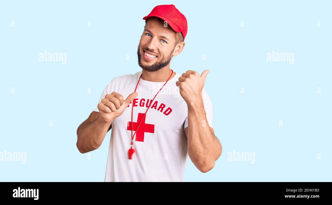 Young caucasian man wearing lifeguard t shirt holding whistle pointing ...