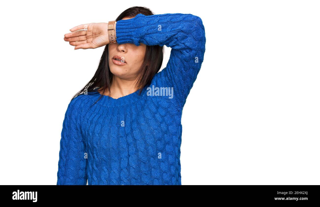 Young Hispanic Woman Wearing Casual Clothes Covering Eyes With Arm