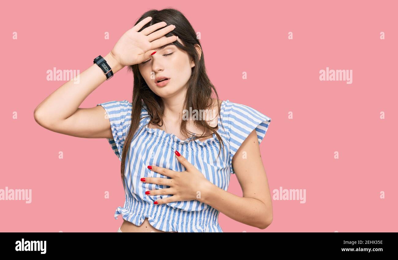 Young beautiful caucasian girl wearing casual clothes touching forehead ...